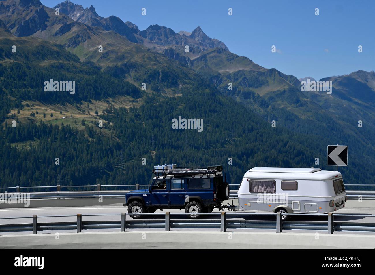 Off-road vehicle with caravan Gotthard Pass, Switzerland Stock Photo ...