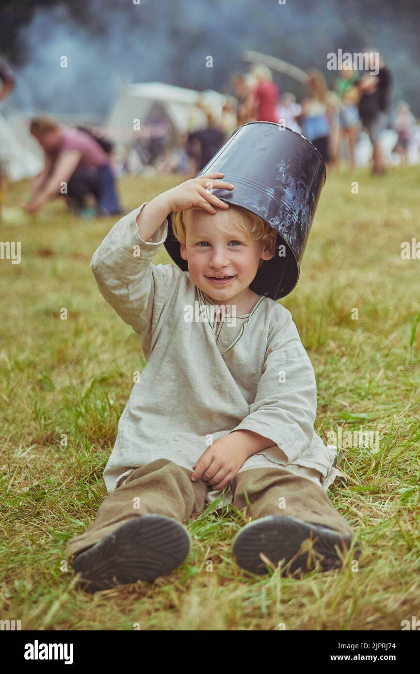 Child bucket on head hi-res stock photography and images - Alamy