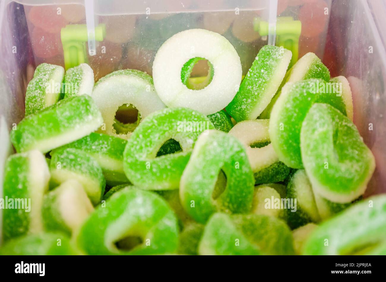 Sweet and green jellies candies in the shop for background Stock Photo ...