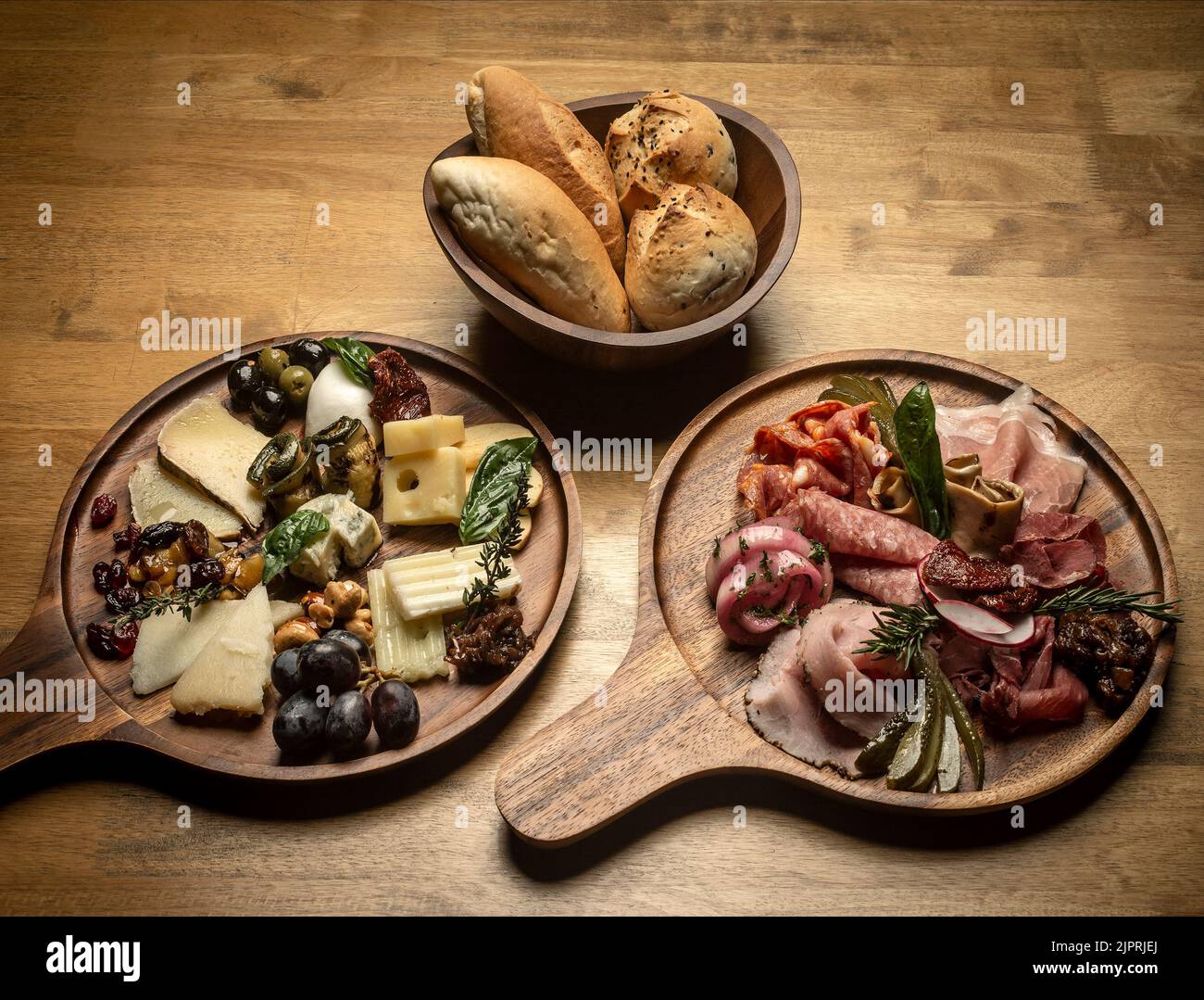 mixed european charcuterie and cheese cold cuts platter on wood table ...