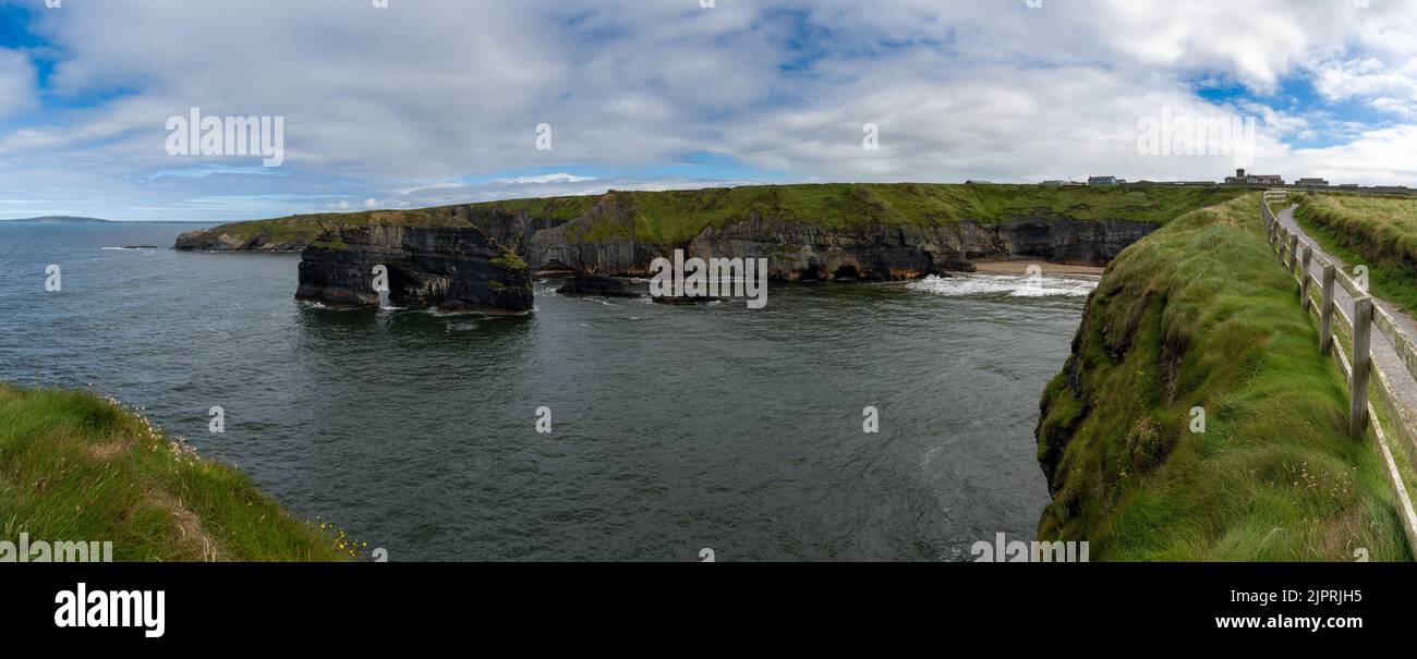 panorama landscape of the Ballybunion Cliff Walk and rugged cliffs and ...