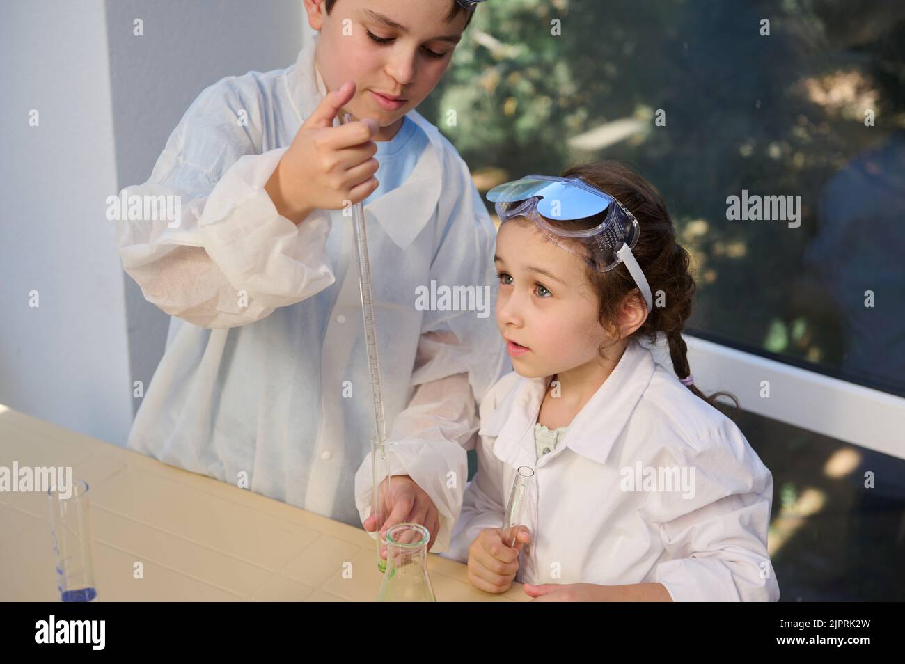 Science children education in chemistry lab. Primary school students ...