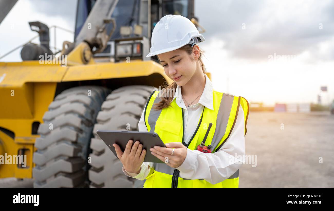 Woman foreman control forklift loading Containers cargo from Truck to ...