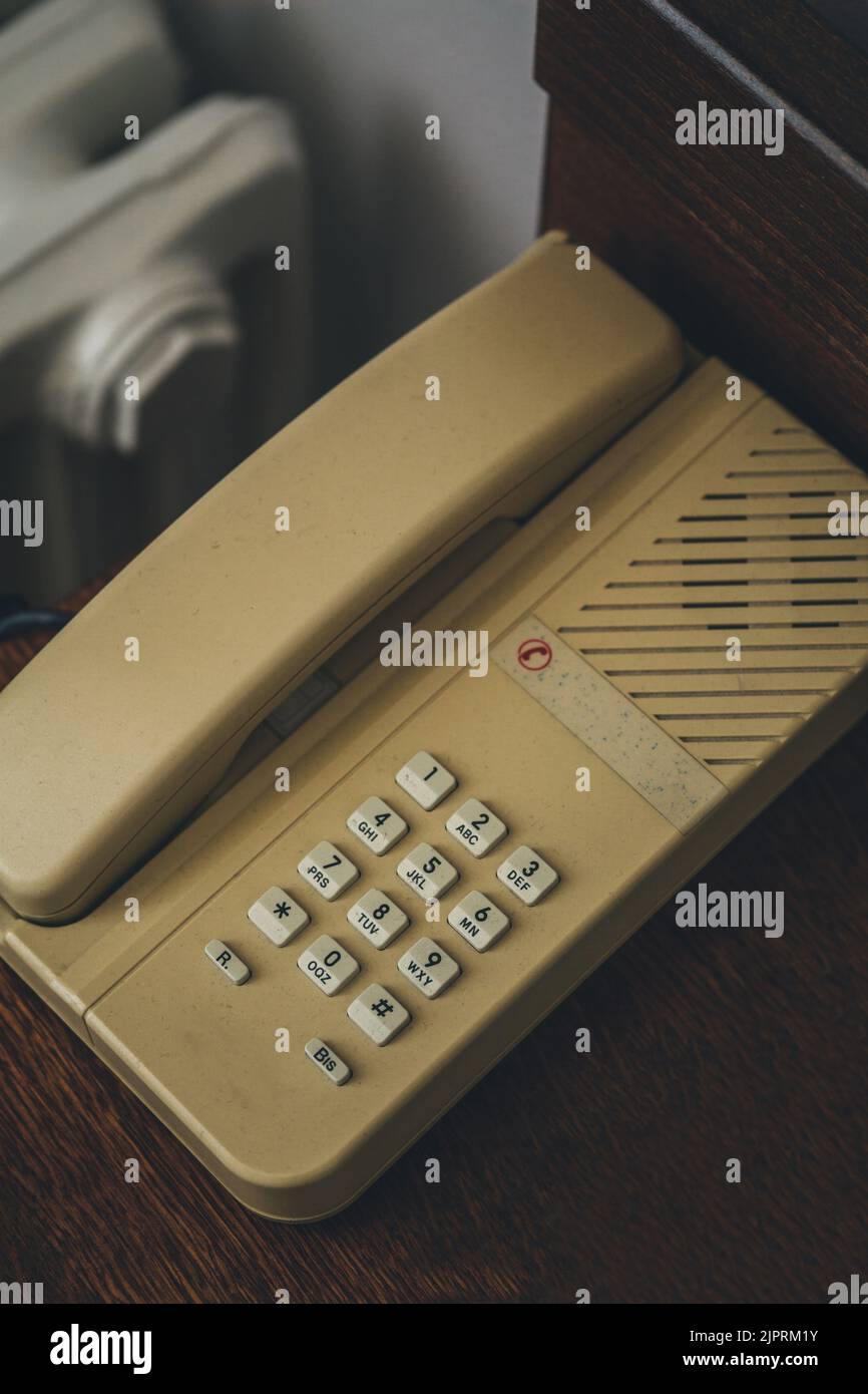 An old retro telephone with digital numbers, vertical shot Stock Photo ...