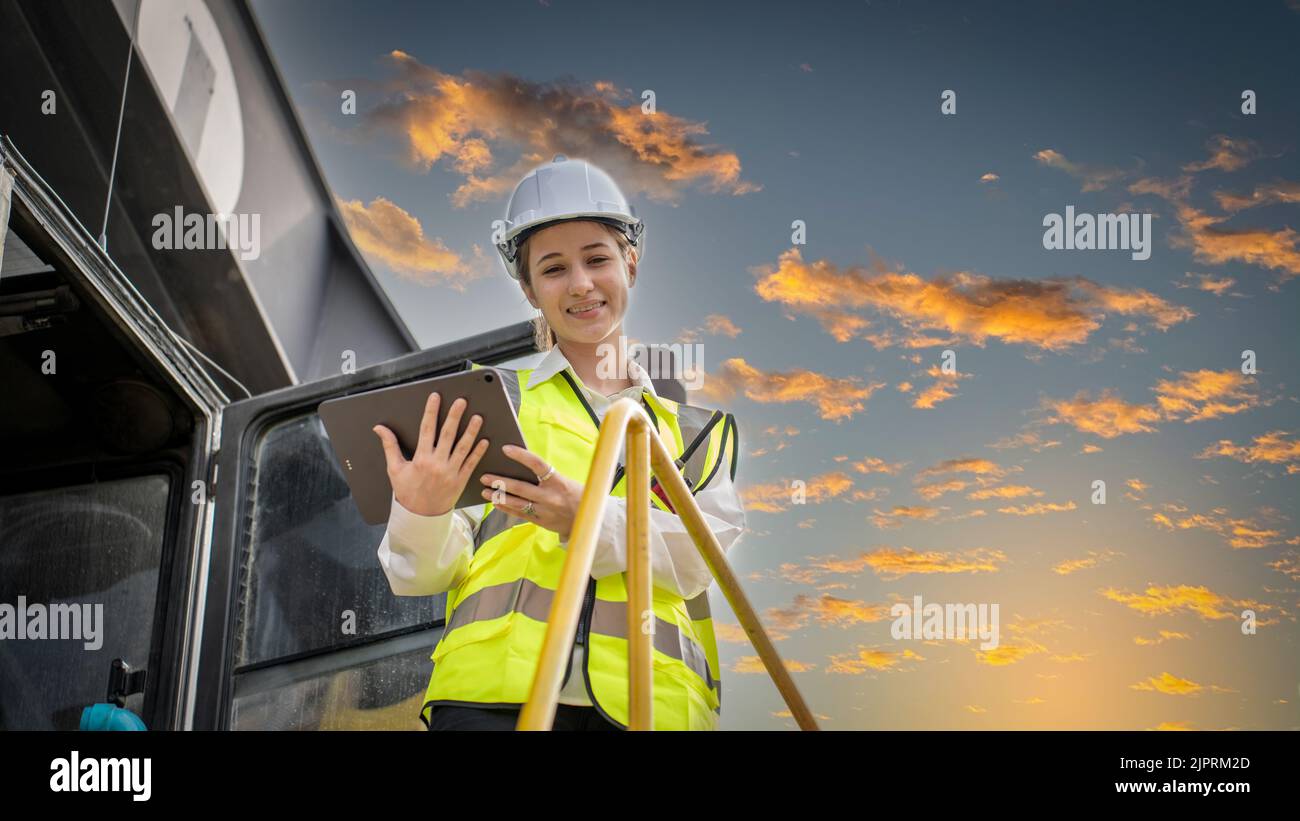 Female Foreman stay on lifting forklift container cargo forklift check ...