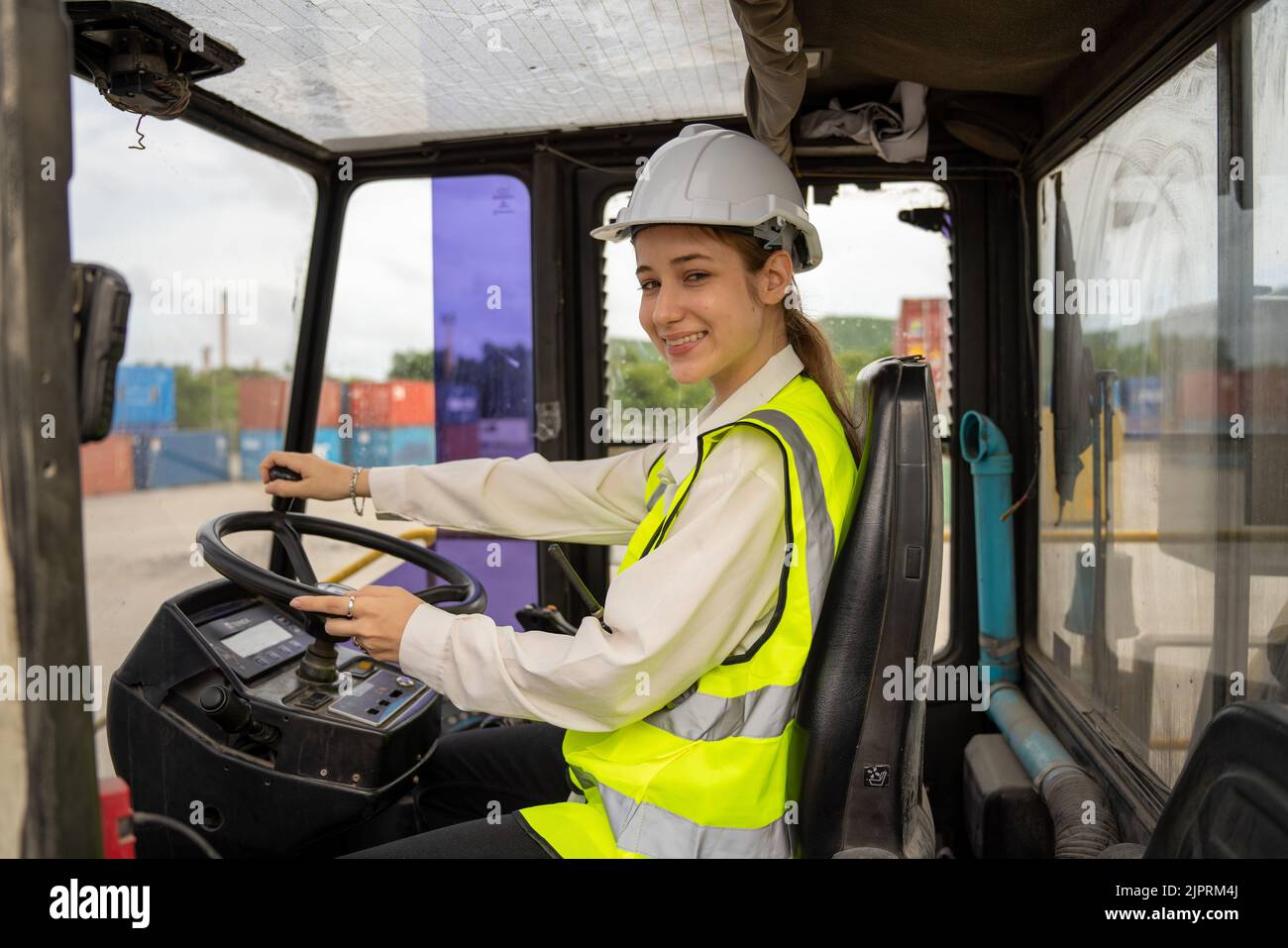 Female Foreman Drive a forklift container cargo forklift and use walkie ...