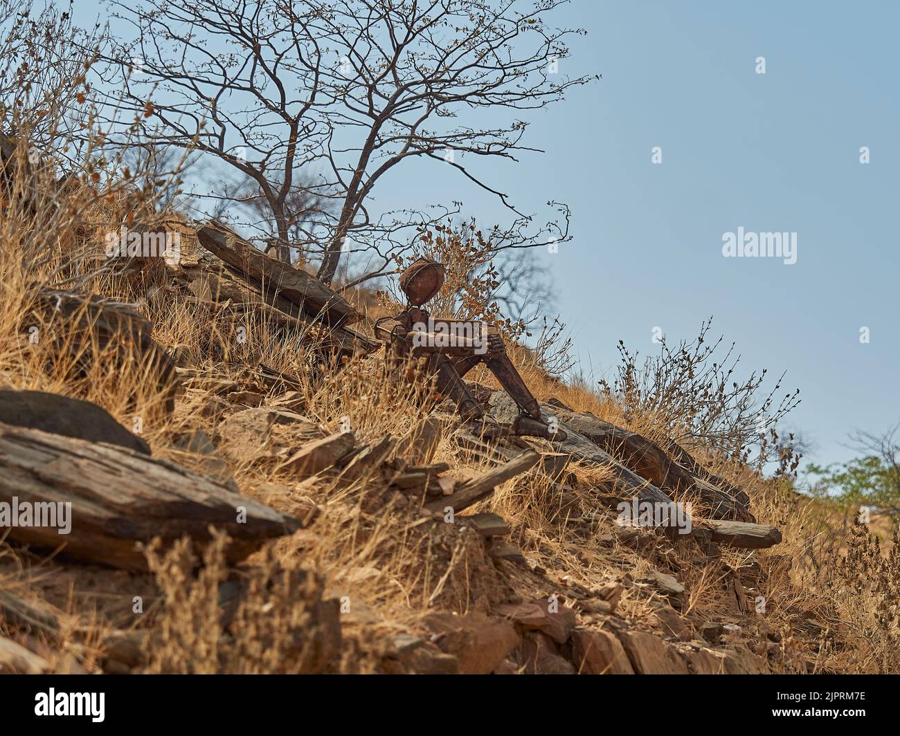 Kaokoveld, Namibia - 11 01 2016: Lone man rock sculpture sitting on the ...
