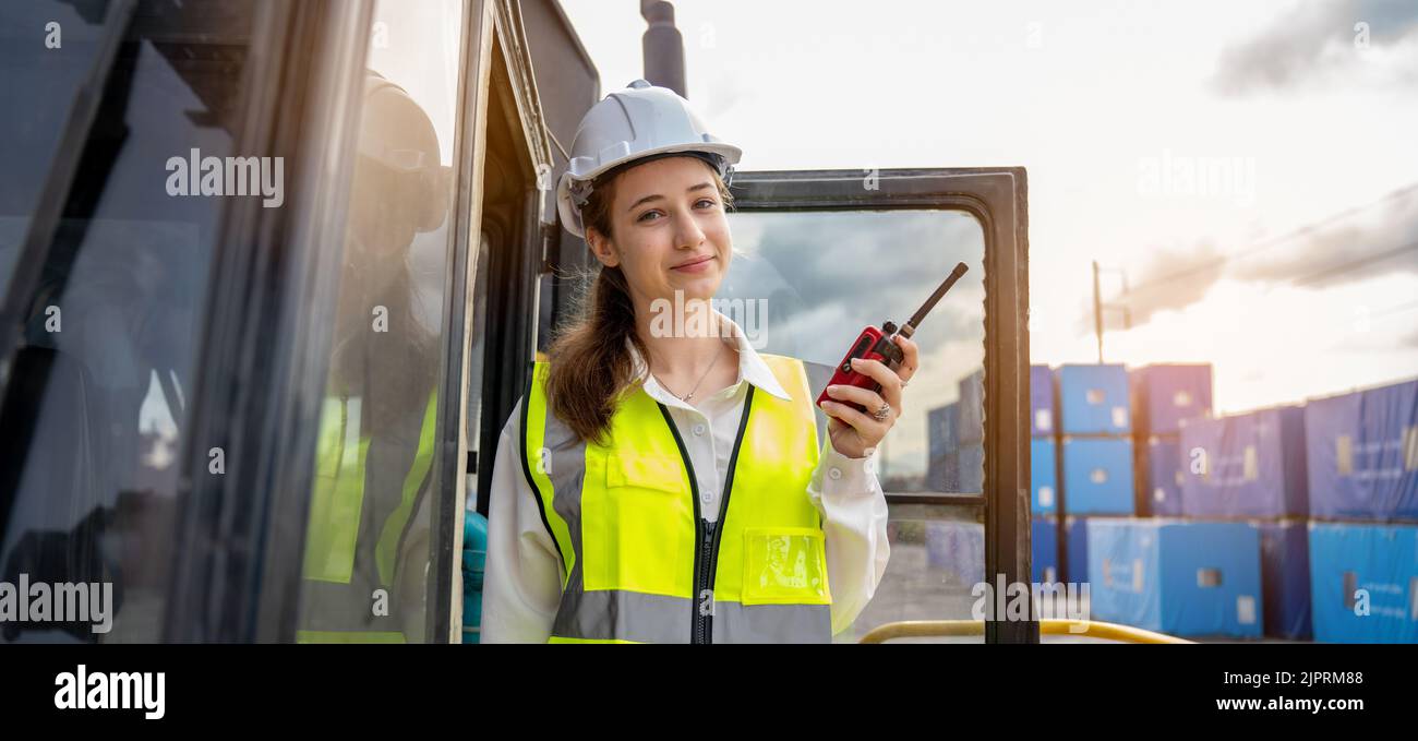 Female Foreman stay on lifting forklift container cargo forklift using ...
