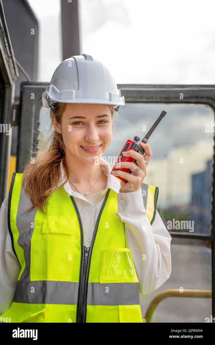 Female Foreman stay on lifting forklift container cargo forklift using ...
