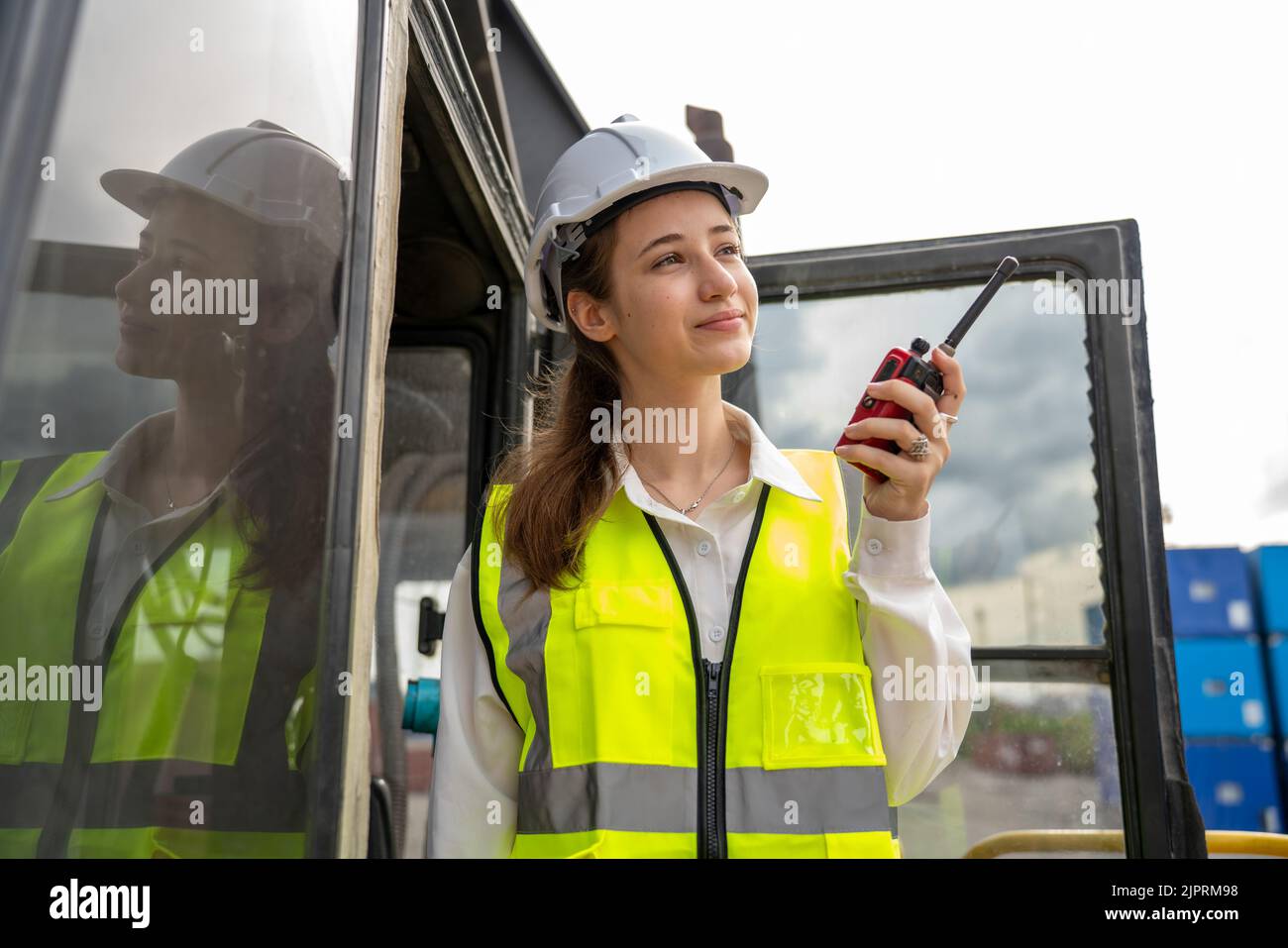 Female Foreman stay on lifting forklift container cargo forklift using ...