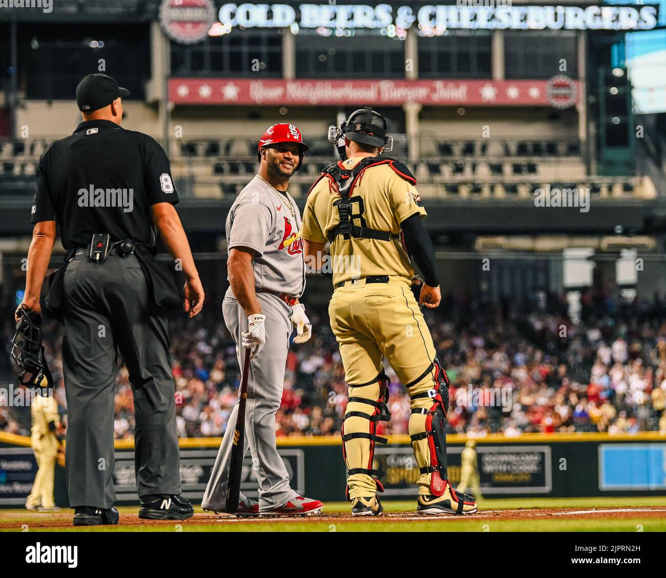 St. Louis Cardinals designated hitter Albert Pujols (5) greeting by Arizona Diamondbacks catcher ...