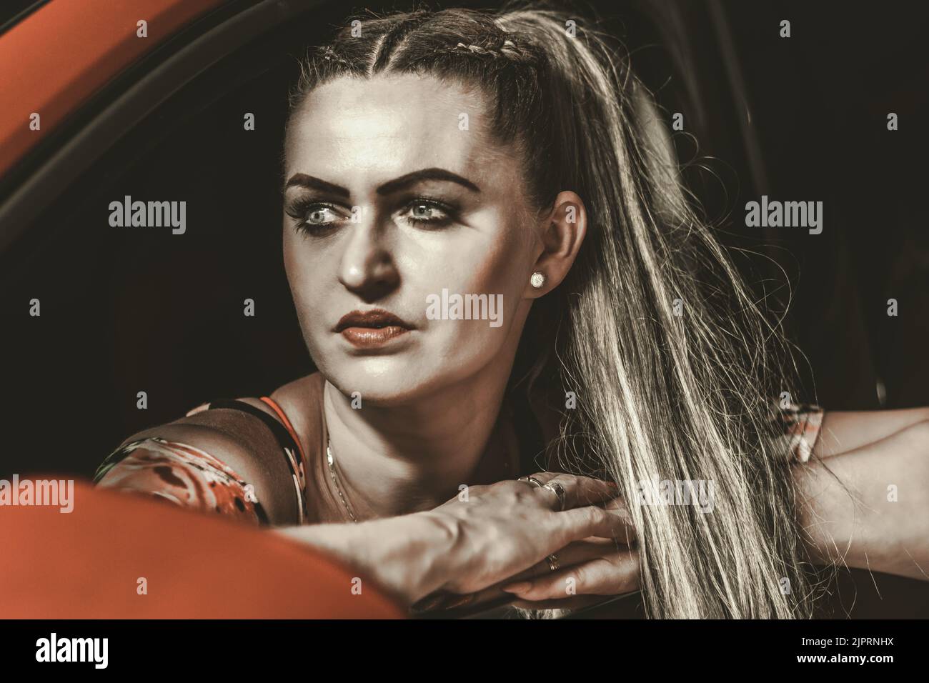 Beautiful lady possing in dark garage with red fiat tipo Stock Photo ...