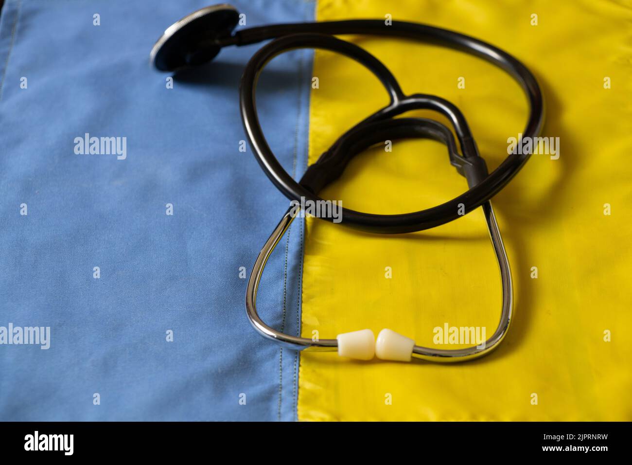 The stethoscope lies on the national flag of Ukraine yellow-blue ...