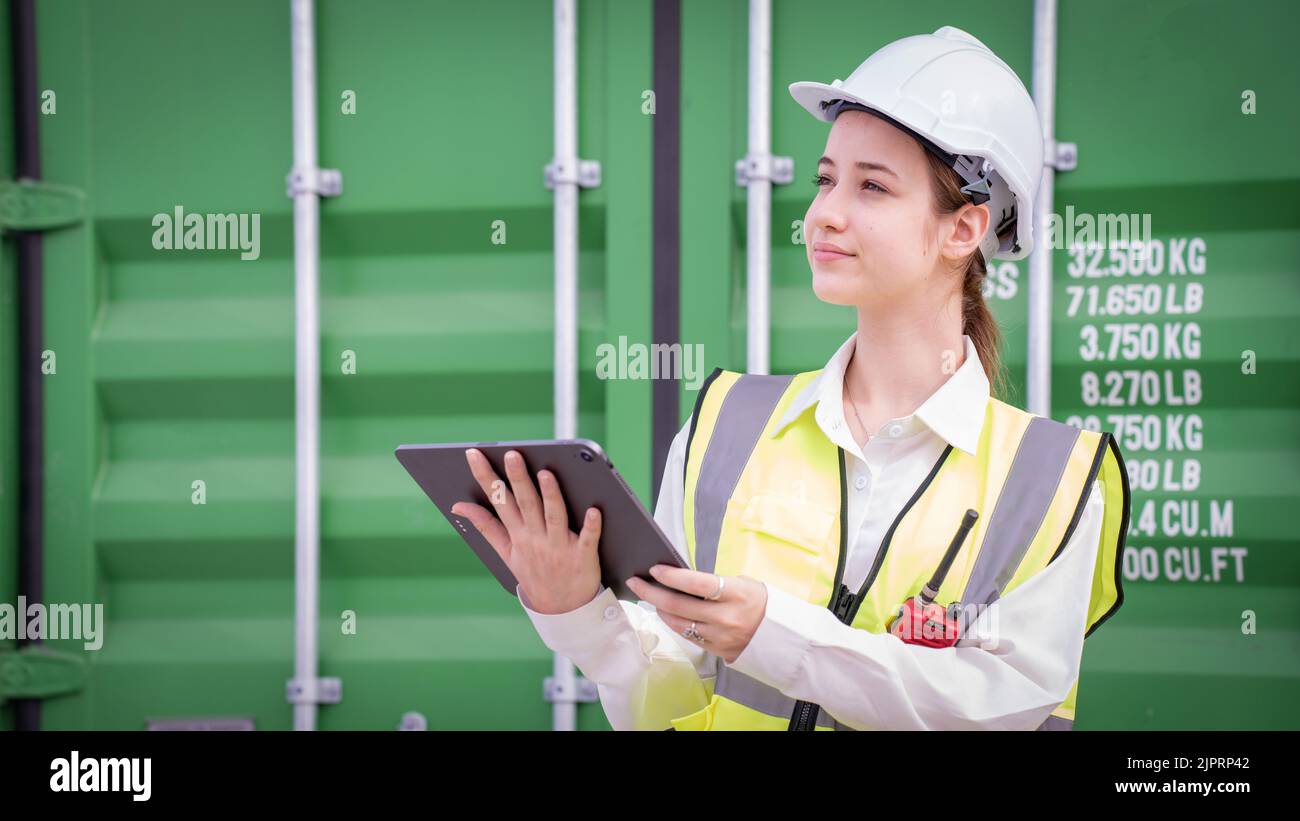 Woman inspector Manager Checking Cargo in Container cargo ...