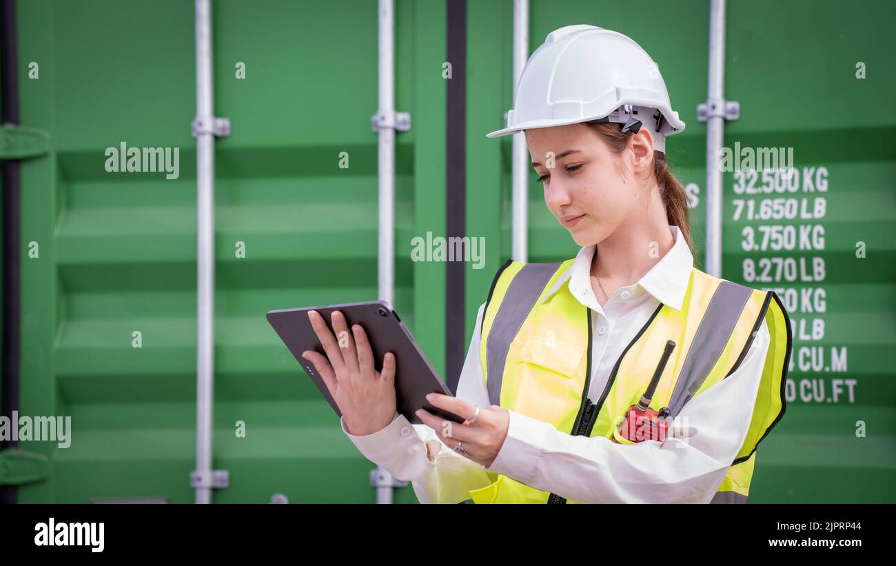 Woman inspector Manager Checking Cargo in Container cargo ...