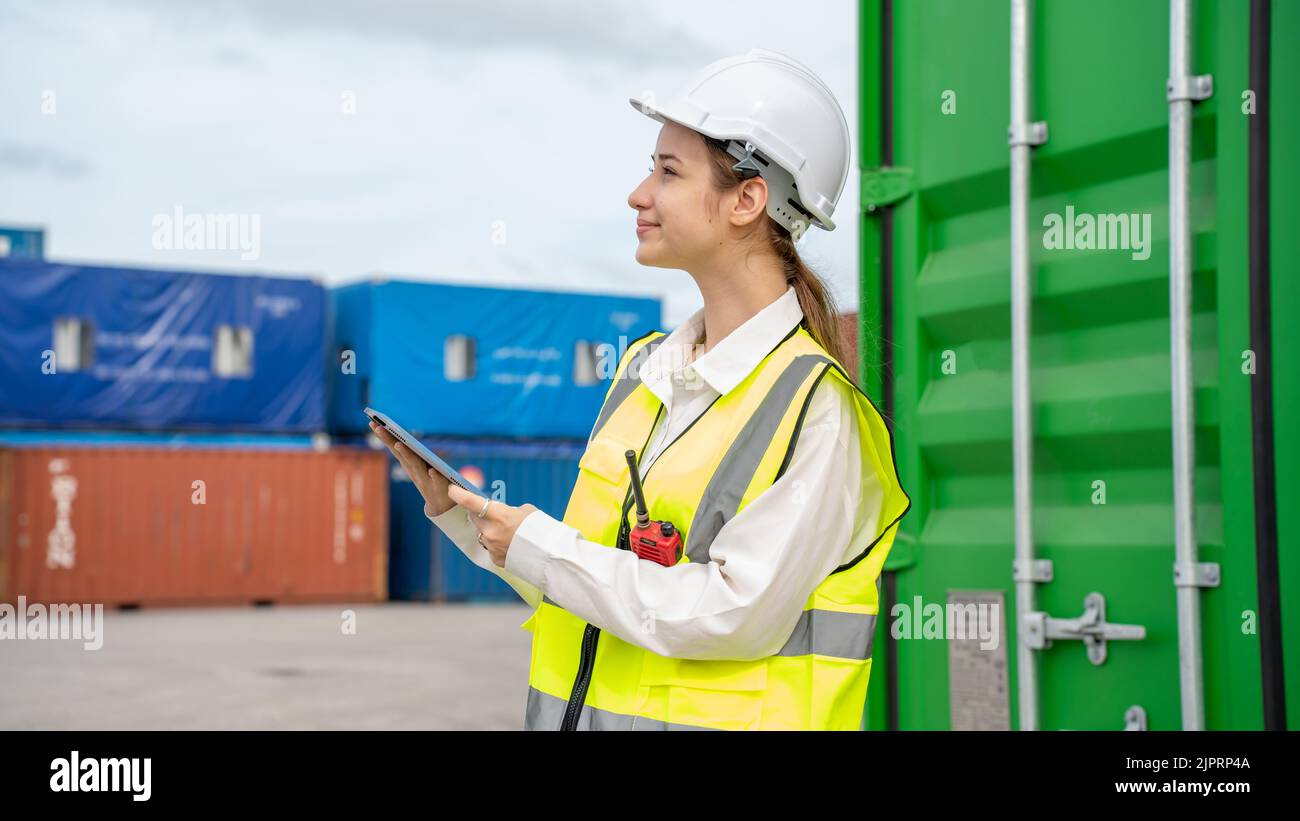 Woman inspector Manager Checking Cargo in Container cargo ...