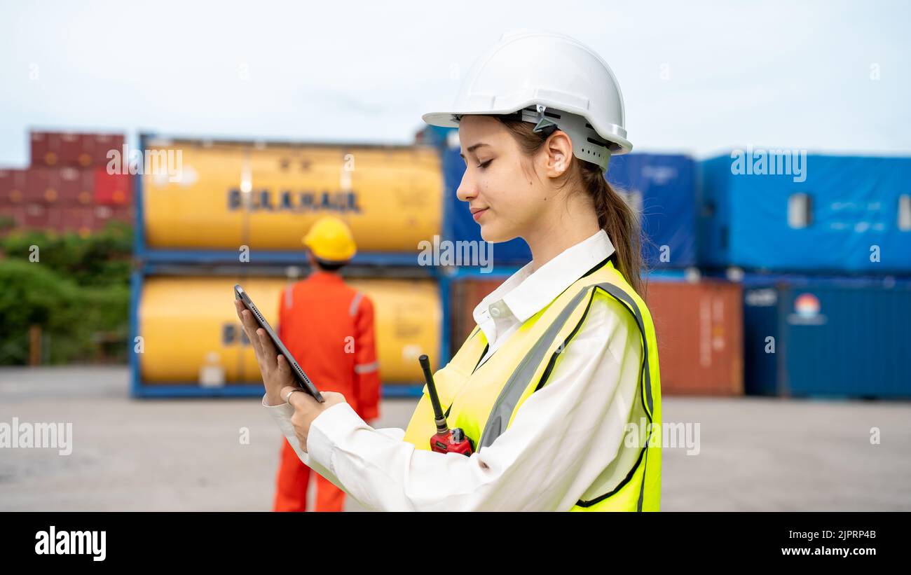 Woman inspector Manager Checking Cargo in Container cargo ...