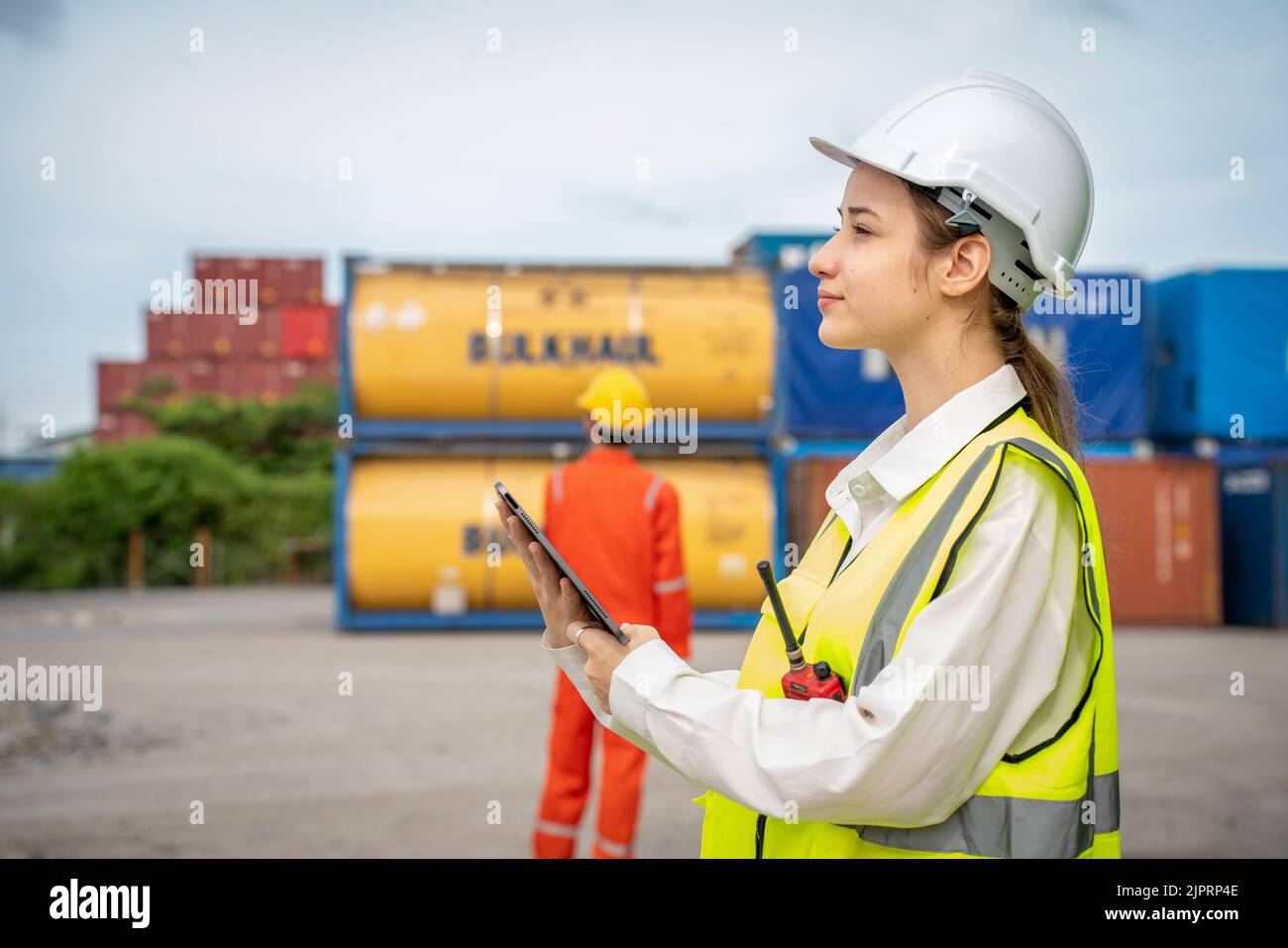 Woman inspector Manager Checking Cargo in Container cargo ...