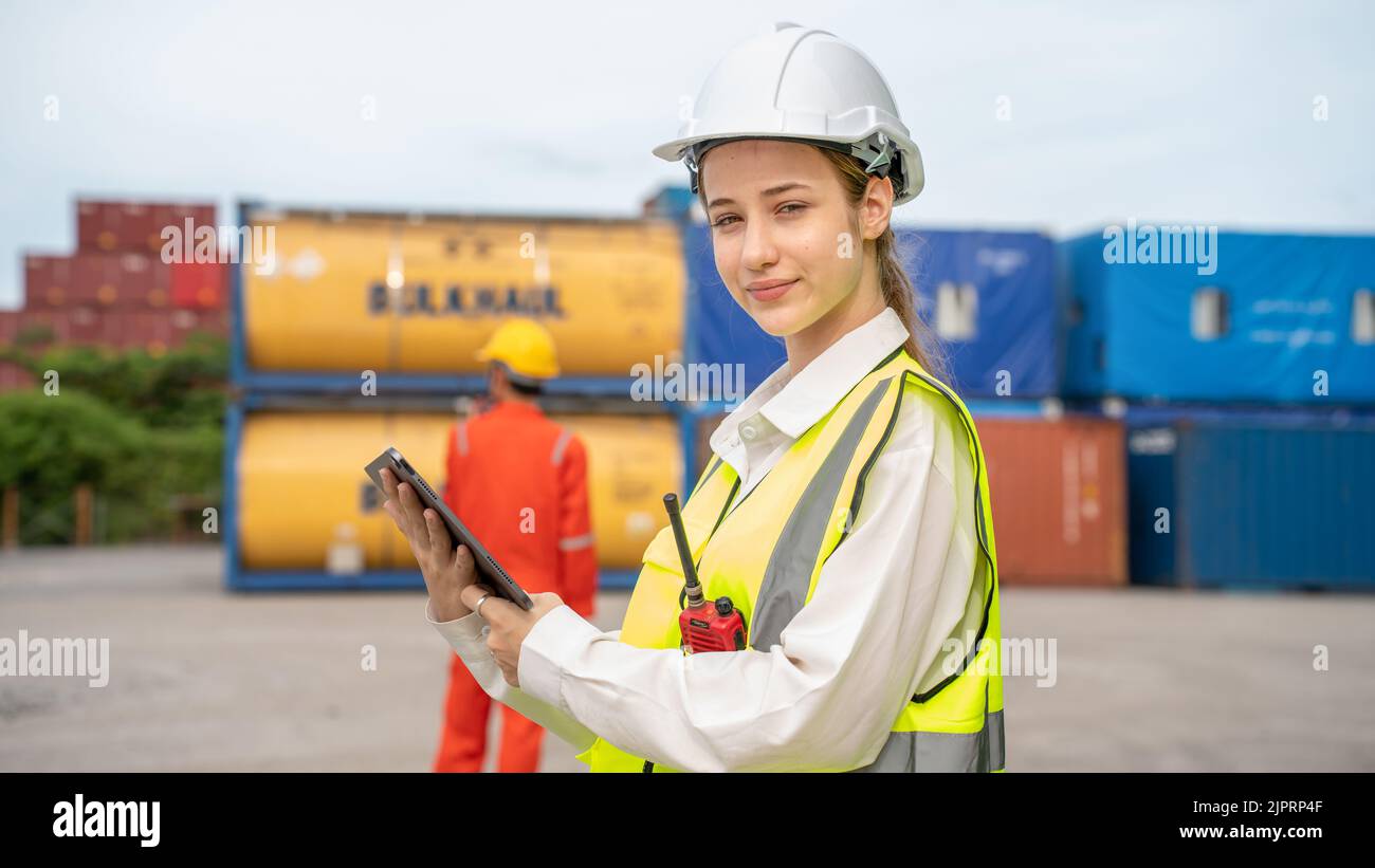 Woman inspector Manager Checking Cargo in Container cargo ...