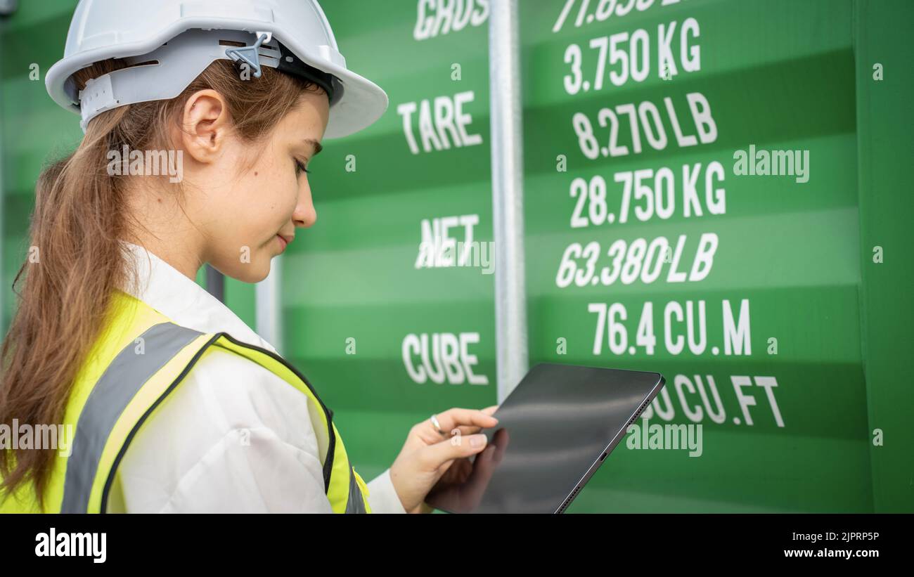 Woman inspector Manager Checking Cargo in Container cargo ...