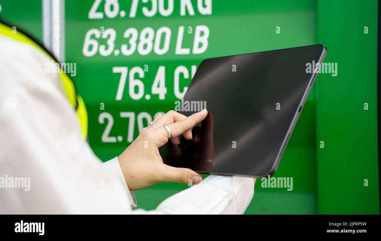 Woman inspector Manager Checking Cargo in Container cargo ...