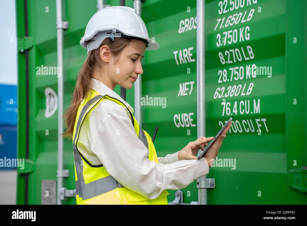 Woman inspector Manager Checking Cargo in Container cargo ...