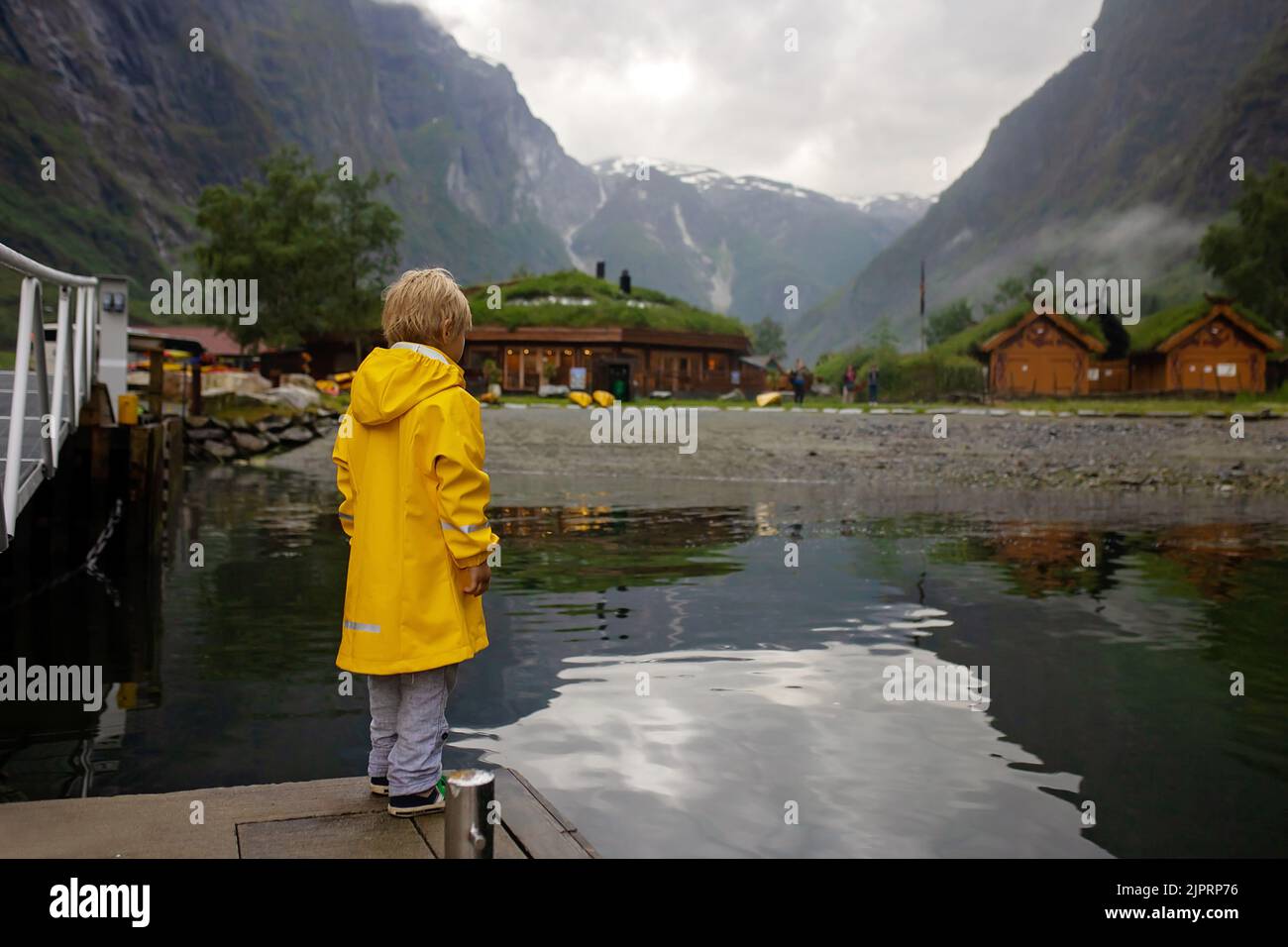 Child, enjoying the amazing views in Norway to fjords, mountains and ...