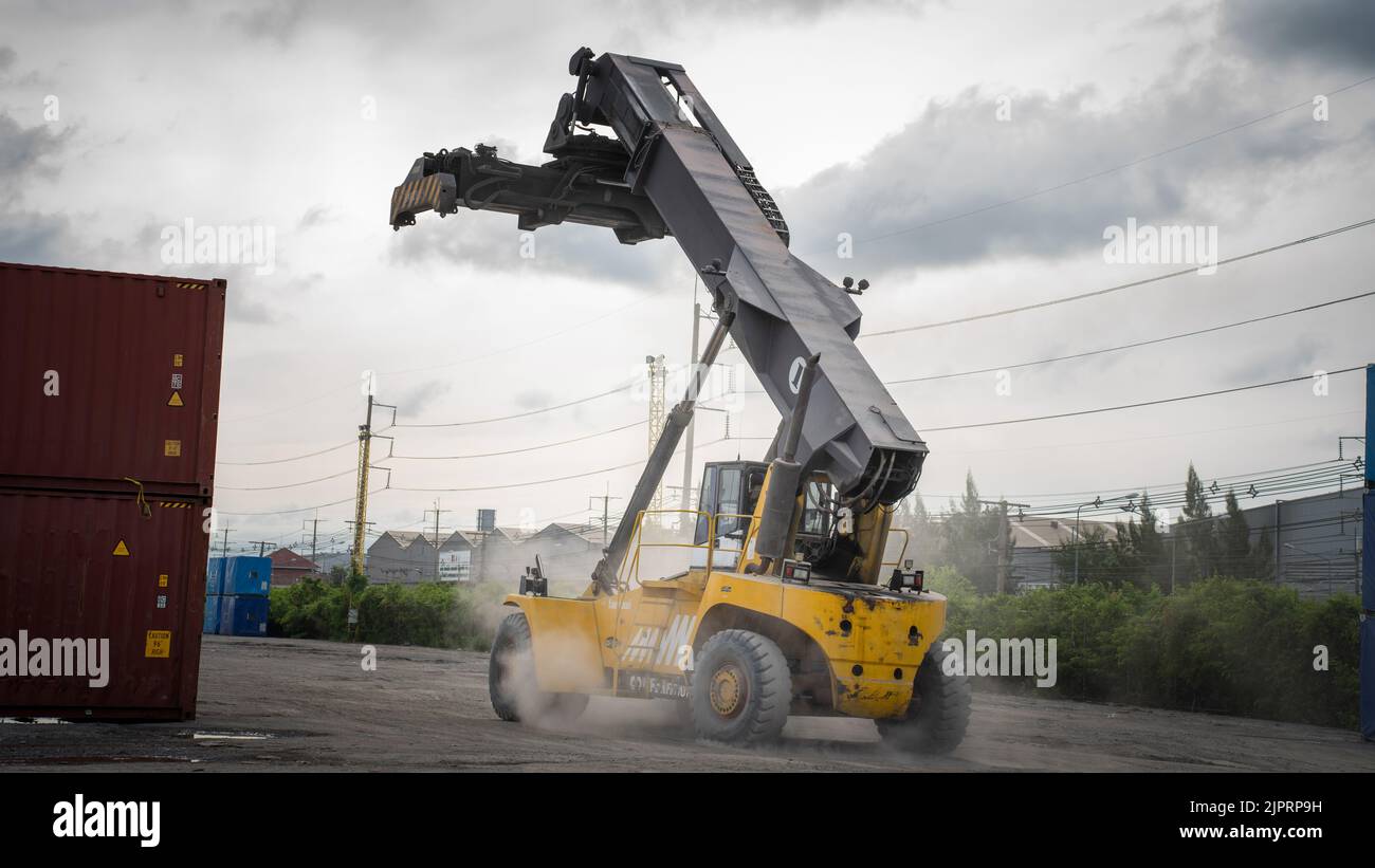 forklift working in the container cargo yard port loading cargo tank ...
