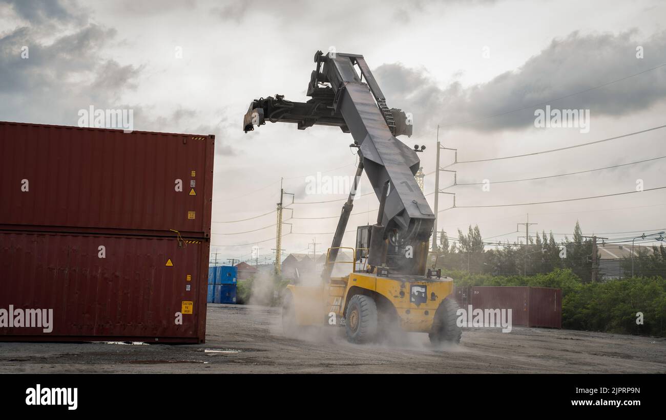 forklift working in the container cargo yard port loading cargo tank ...