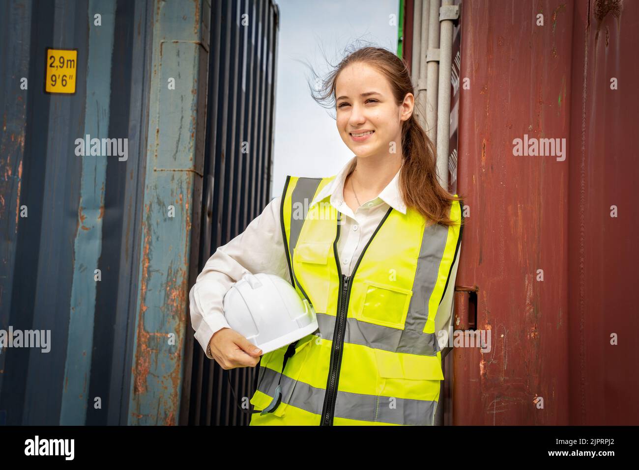 Woman foreman smile at side of Cargo container in warehouse , Manager ...