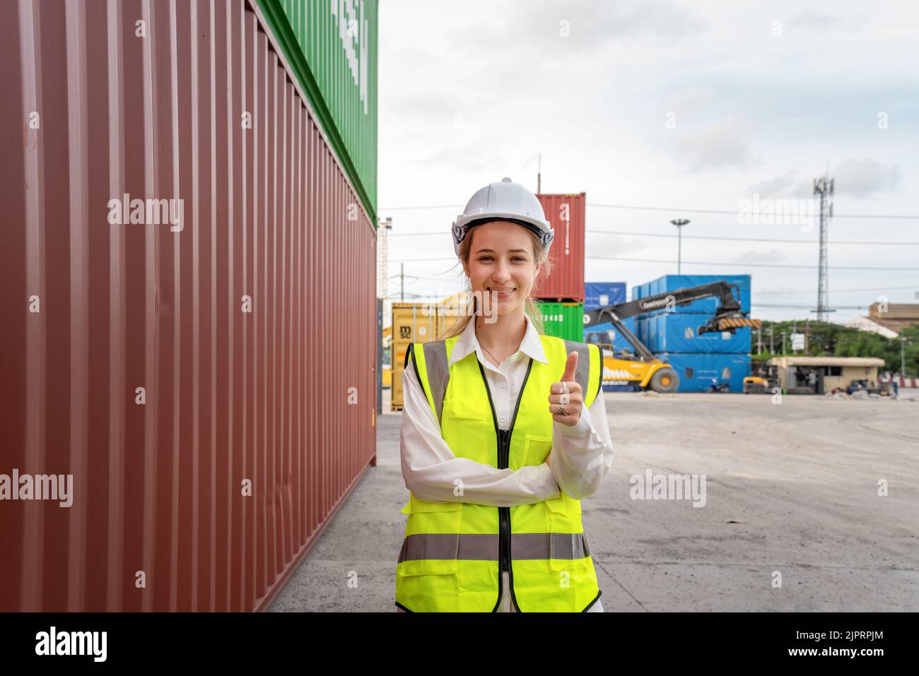 Woman foreman smile at side of Cargo container in warehouse , Manager ...