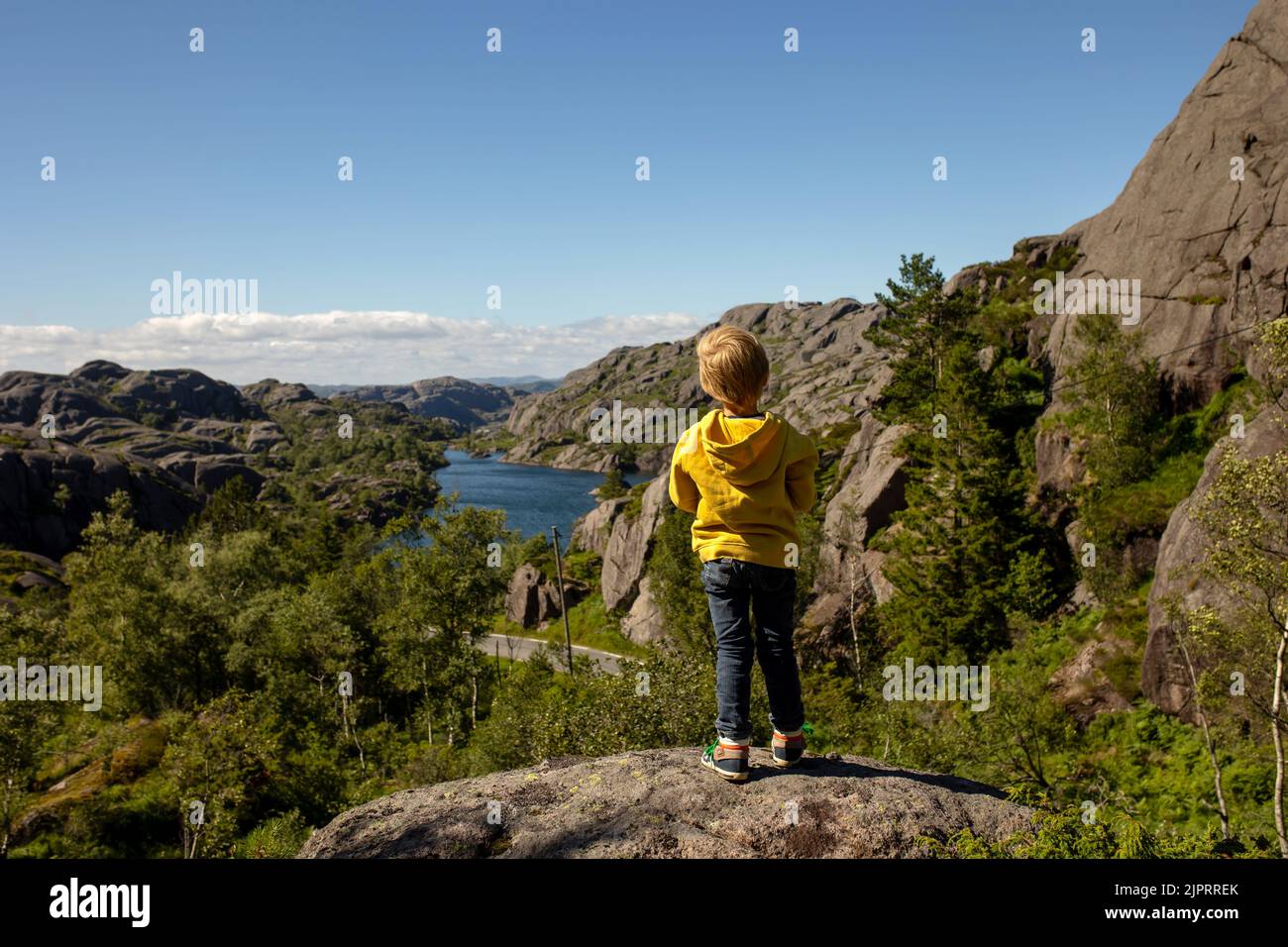 Happy people, enjoying amazing views in South Norway coastline, fjords ...