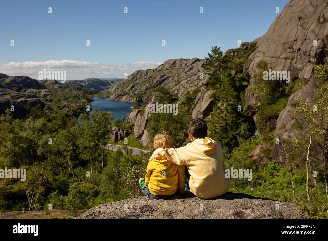 Happy people, enjoying amazing views in South Norway coastline, fjords ...