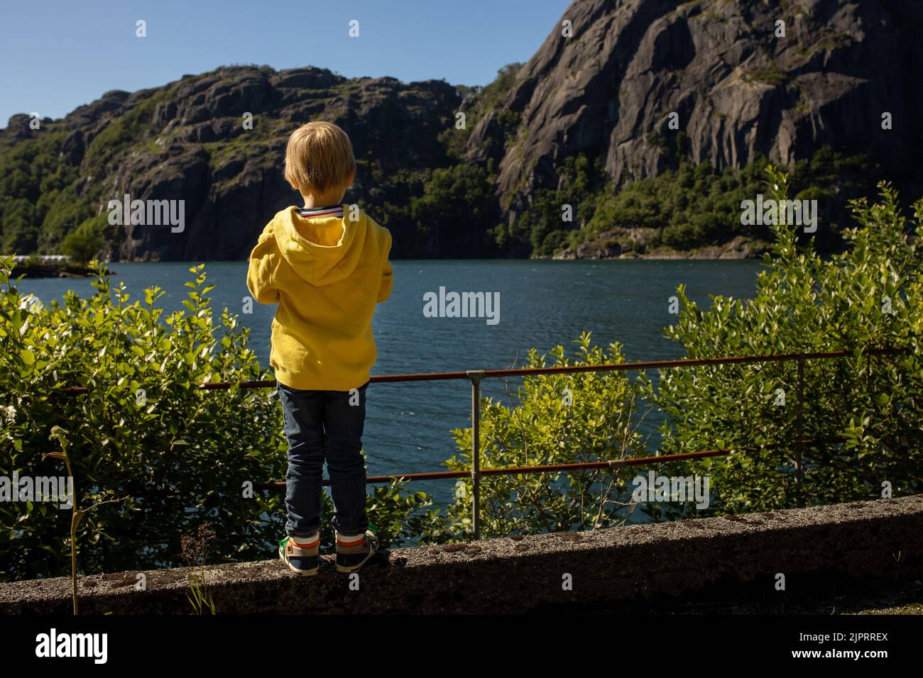 Happy people, enjoying amazing views in South Norway coastline, fjords ...