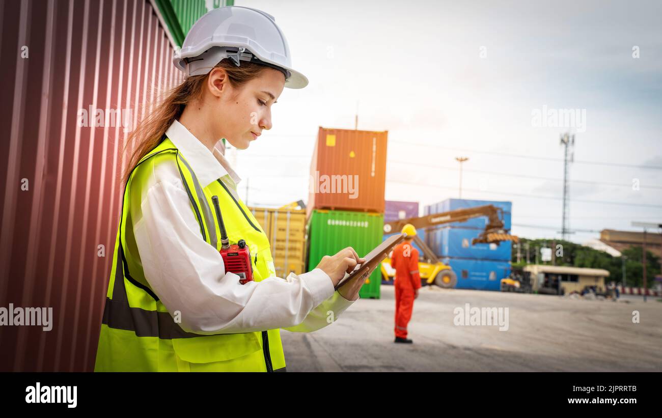 Woman foreman smile at side of Cargo forklift in warehouse , Manager ...