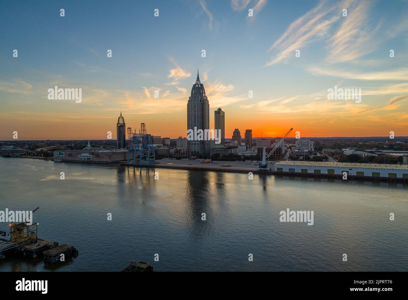 The downtown Mobile, Alabama waterfront skyline at sunset Stock Photo ...