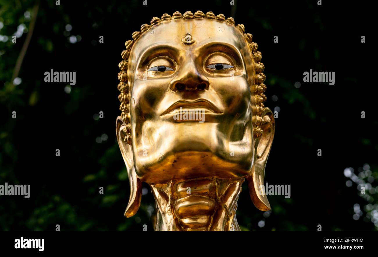 Golden statue at the landmark Wat Suthat Buddhist Temple in Bangkok ...