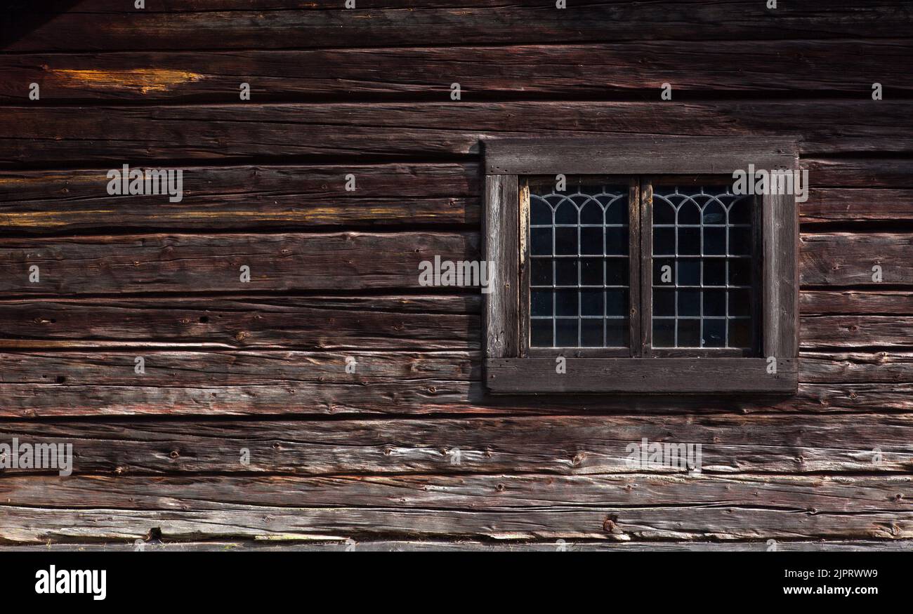 Elegant paned windows at a wooden, timber wall. Powerful timber, and ...