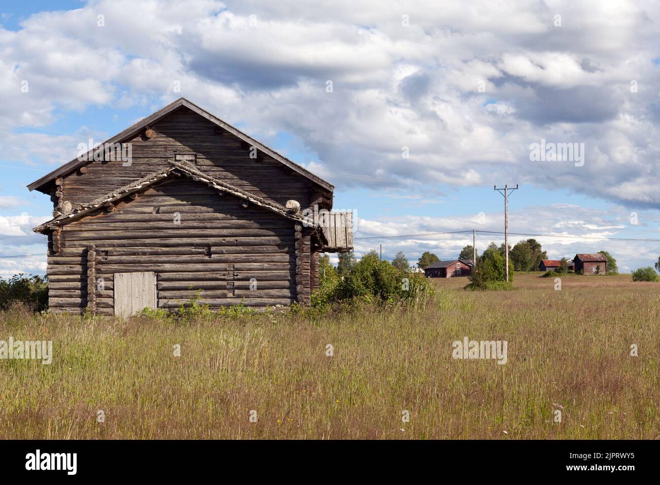 Wooden barns, log, and timber buildings in the farmland. Agriculture in ...