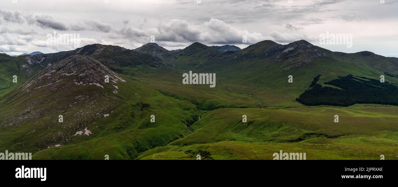 panorama landscape view of the Twelve Bens mountains in Connemara ...
