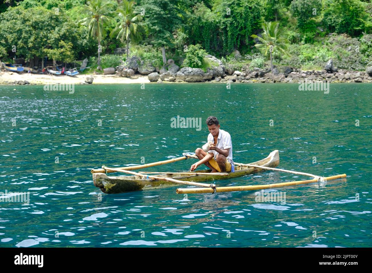 Indonesia Alor Island - Fisherman in outrigger canoe Stock Photo - Alamy