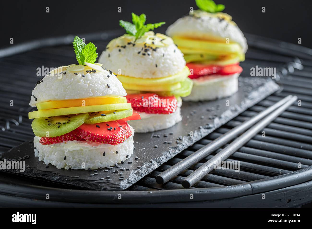 Aromatic and sweet sushi burger with strawberries and mascarpone as ...