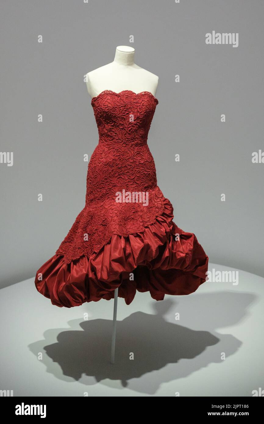 View of a red evening dress exhibited in the "Balenciaga Character ...