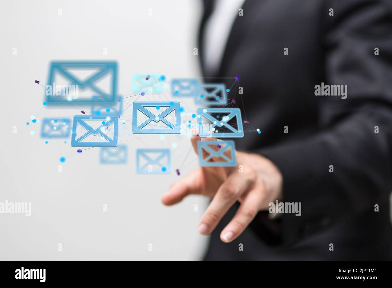 A man tapping floating 3D rendered black mail icons Stock Photo - Alamy