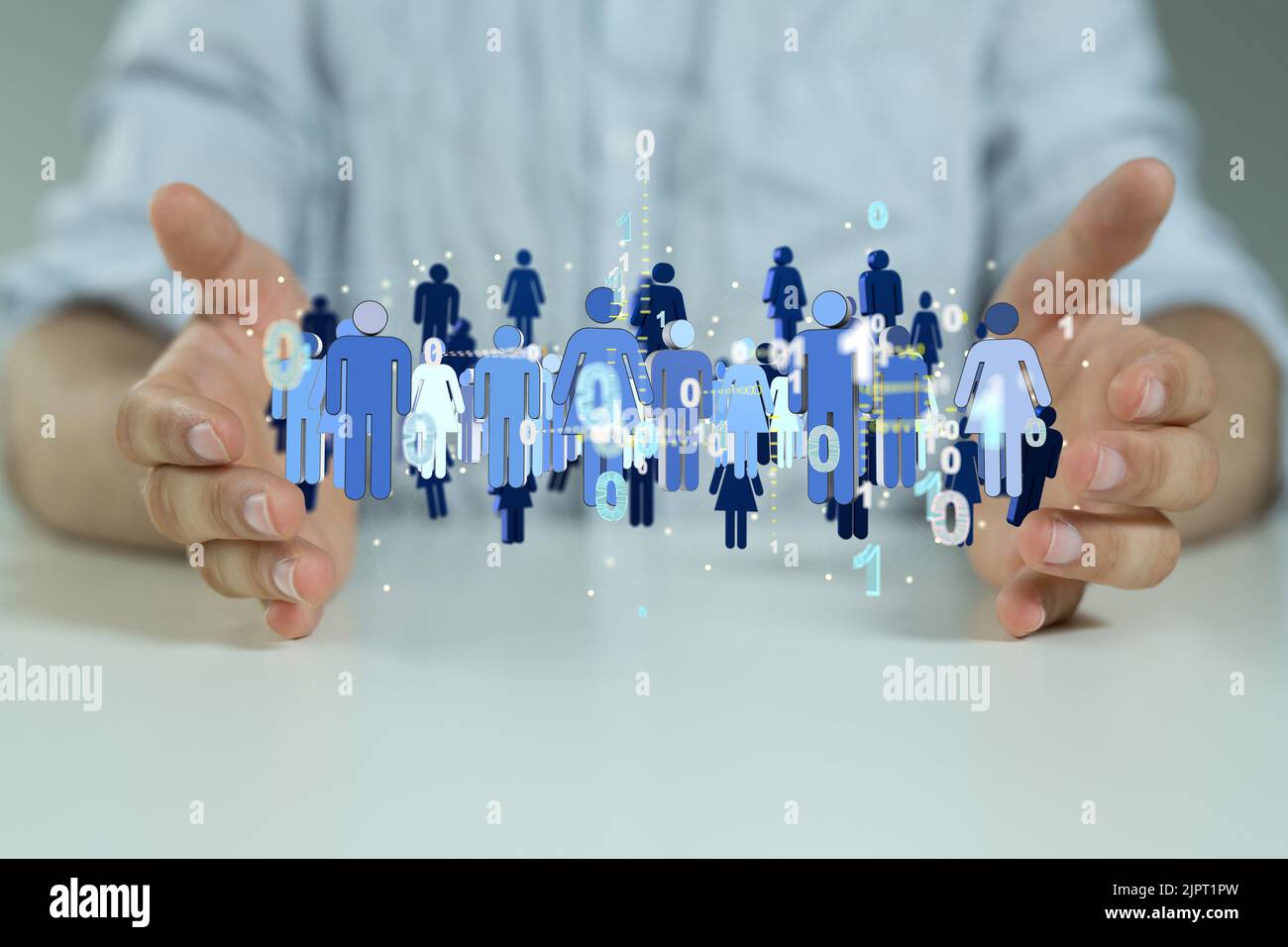 The 3d rendered people icons and binary codes hovering over male hands ...