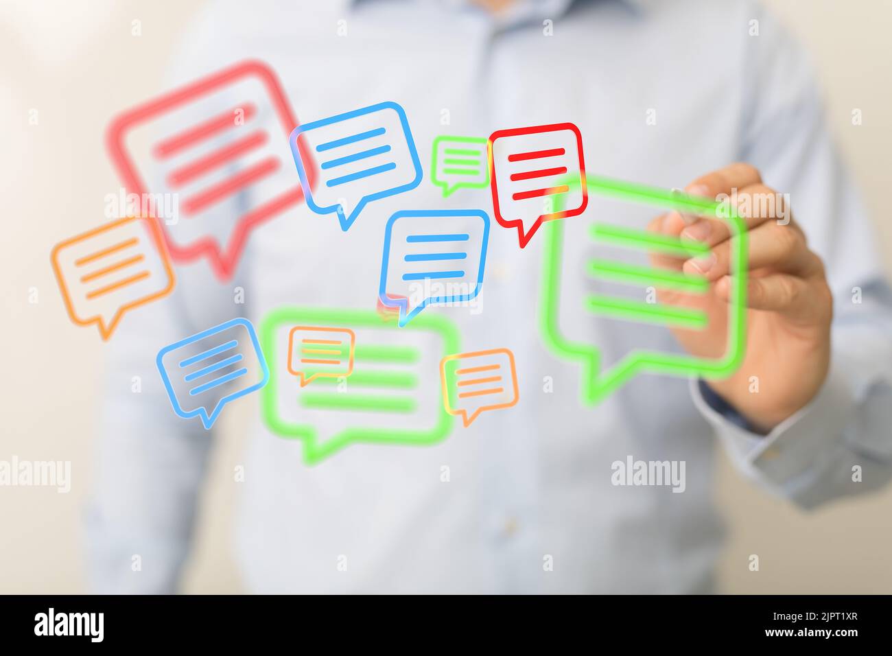 A man tapping a floating 3D rendered colorful message icons Stock Photo ...