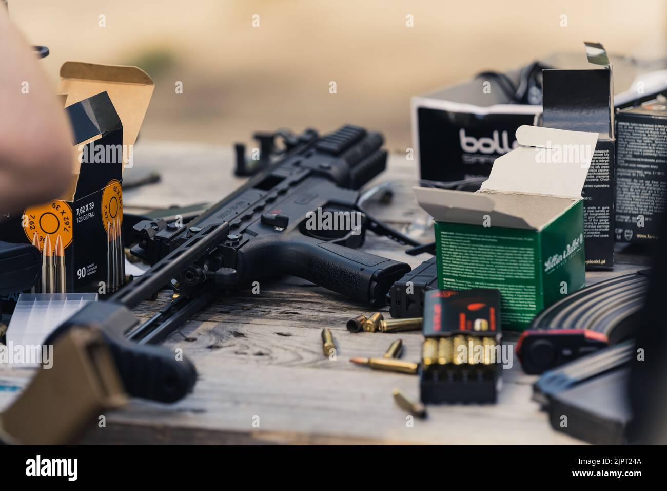 2022.08.07 Modlin, Poland - Submachine gun and various bullets and ...