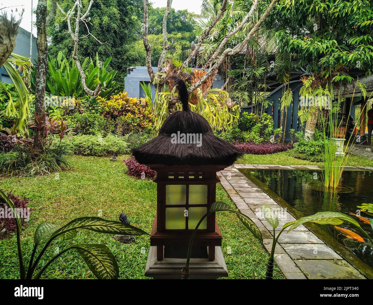 A traditional Lampion at the garden in Indonesia with lush green trees ...
