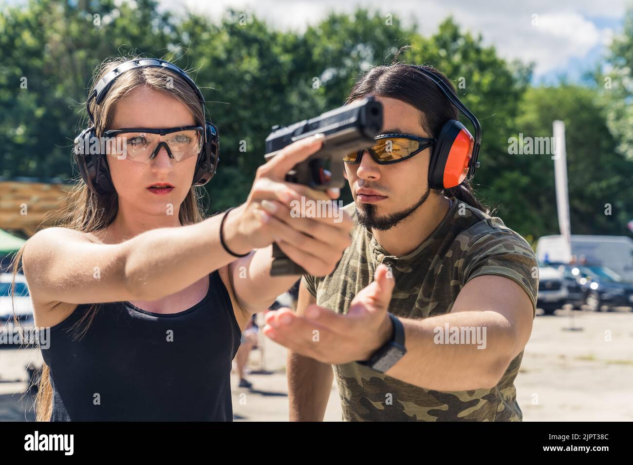 Woman gun firing range hi-res stock photography and images - Alamy