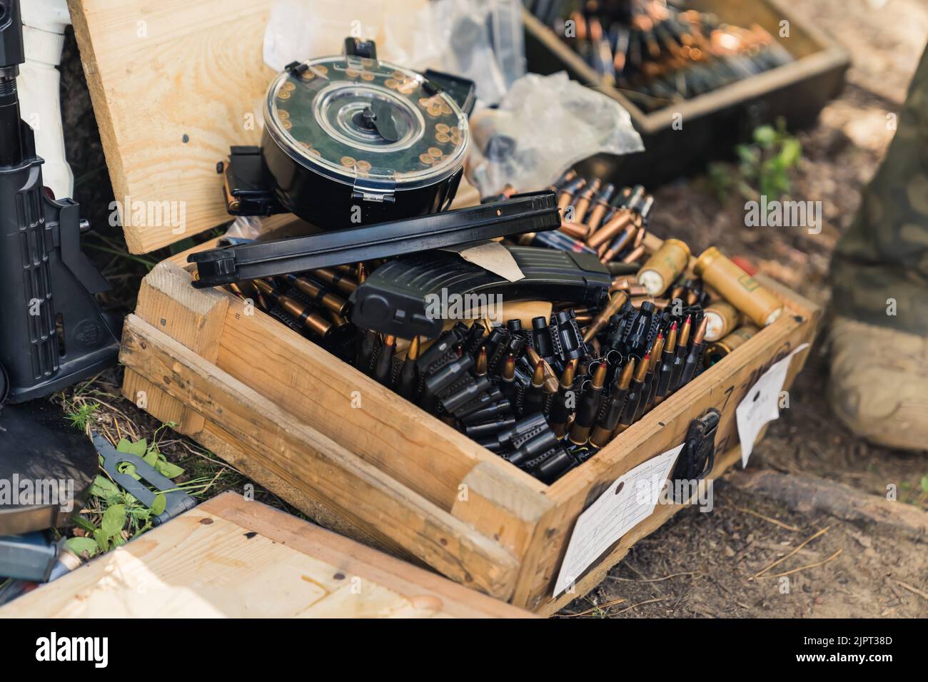 Military equipment bullets ammunition clips stored in wooden boxes ...